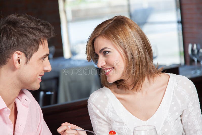 Couple in love are eating stock photo. Image of restaurant - 56617718