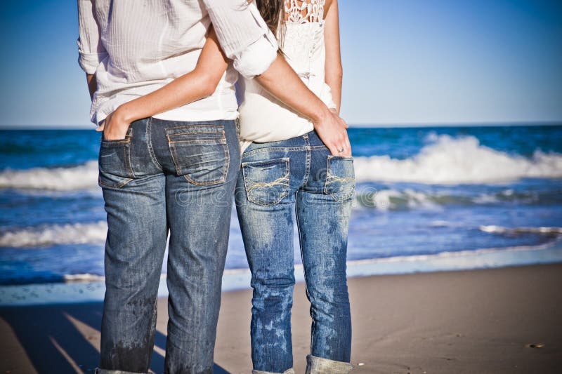 Couple in Love Embraced from Behind on the Beach Stock Image - Image of ...