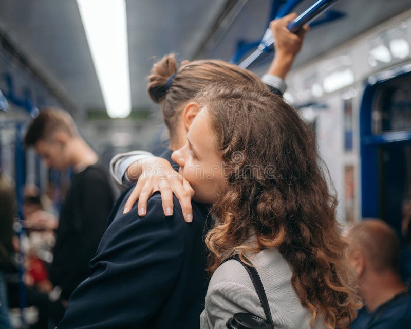 Couple in Love Embraces on a Subway Train. Stock Image - Image of love ...