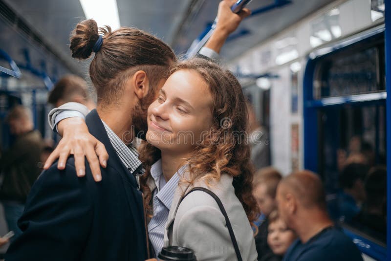 Couple in Love Embraces on a Subway Train. Stock Photo - Image of ...