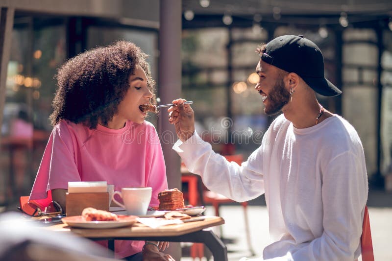 Couple in Love Feeding Each Other and Looking Happy Stock Photo - Image ...