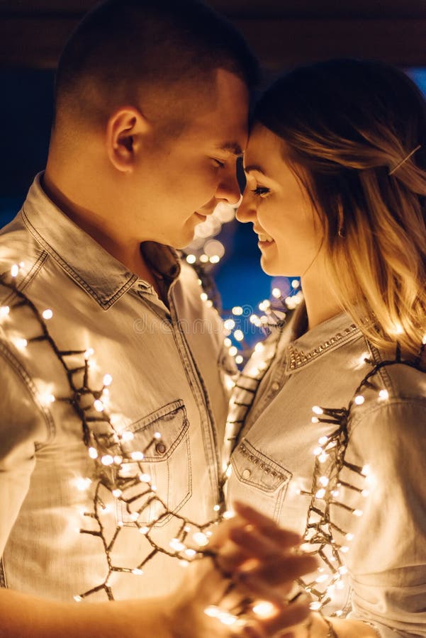 Couple in Love Hugging in Dark among Multitude of Lights Stock Photo ...