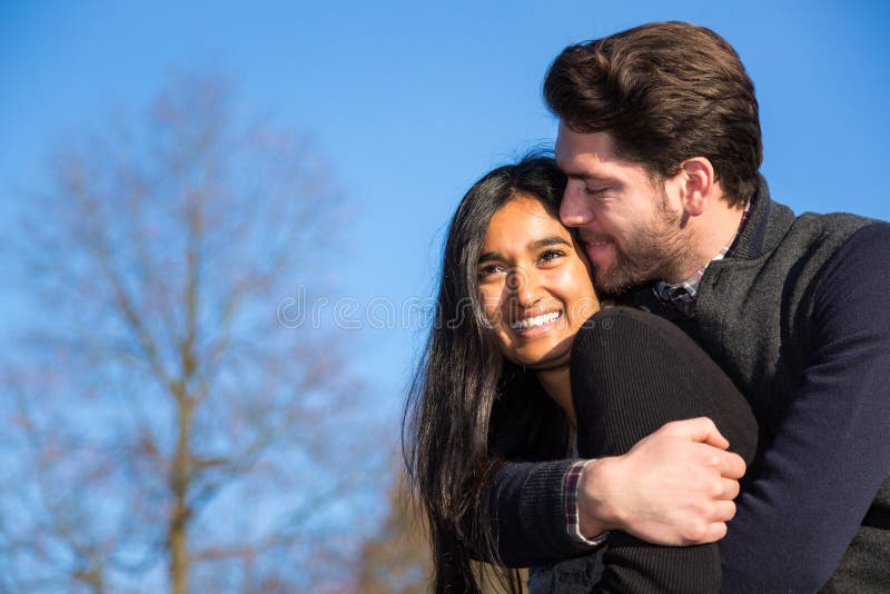 Couple in Love Hugging and Kissing Outside Stock Photo - Image of ...