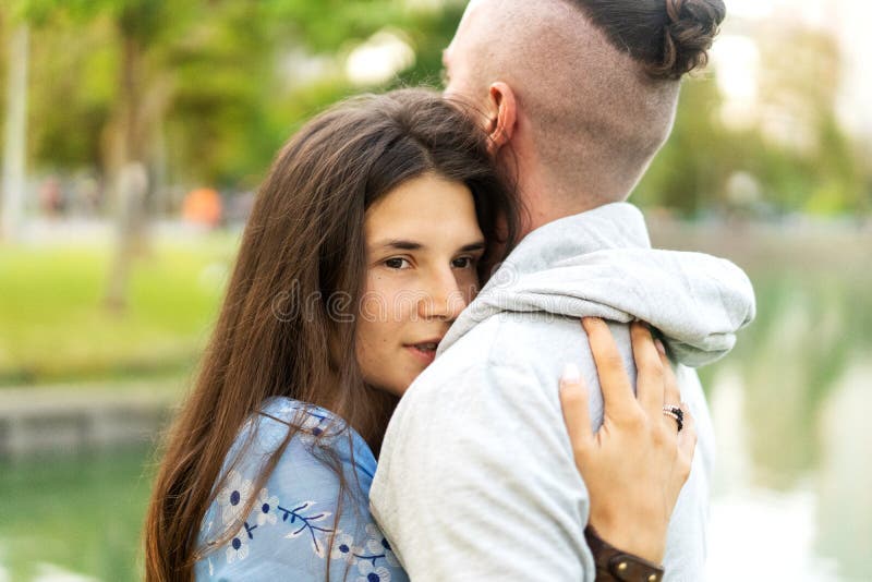 Couple in Love Hugging at Sunset and Looking at Each Other Stock Photo ...