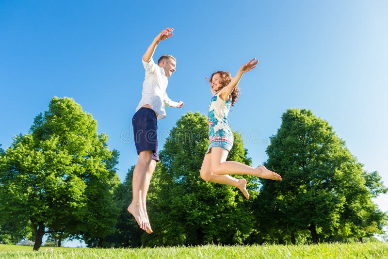 Couple in Love Jumping on Park Stock Photo - Image of handsome, date ...