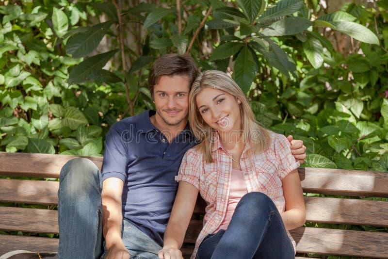 Couple in love in the park stock image. Image of releases - 64047533