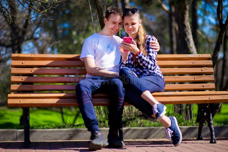 Couple in Love Rest on Park Bench and Take Selfie. Stock Image - Image ...