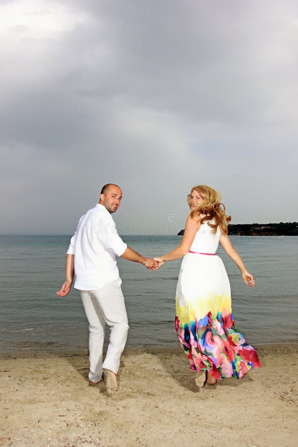 Couple in Love Running while Looking Back Stock Image - Image of male ...