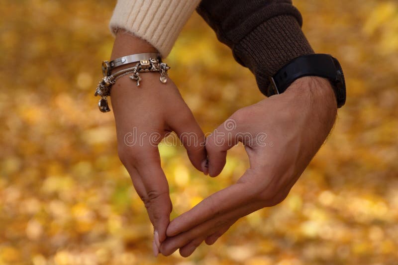 A Couple in Love Shows a Heart with Their Hands Stock Image - Image of ...