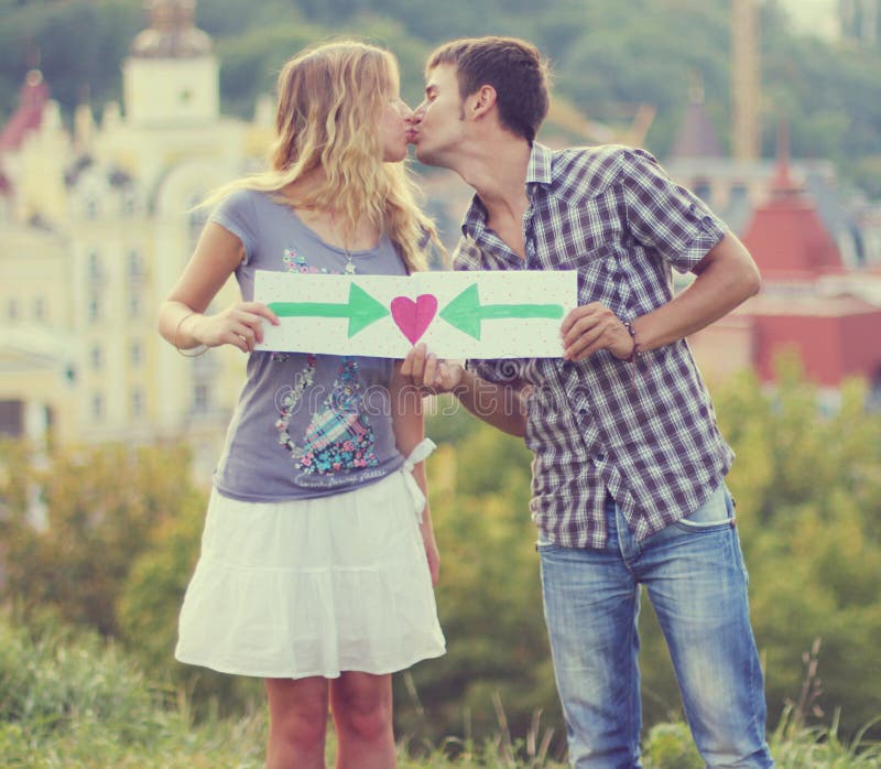 Romantic Young Couple in Love, Man Holding Surprise Bouquet of R Stock ...