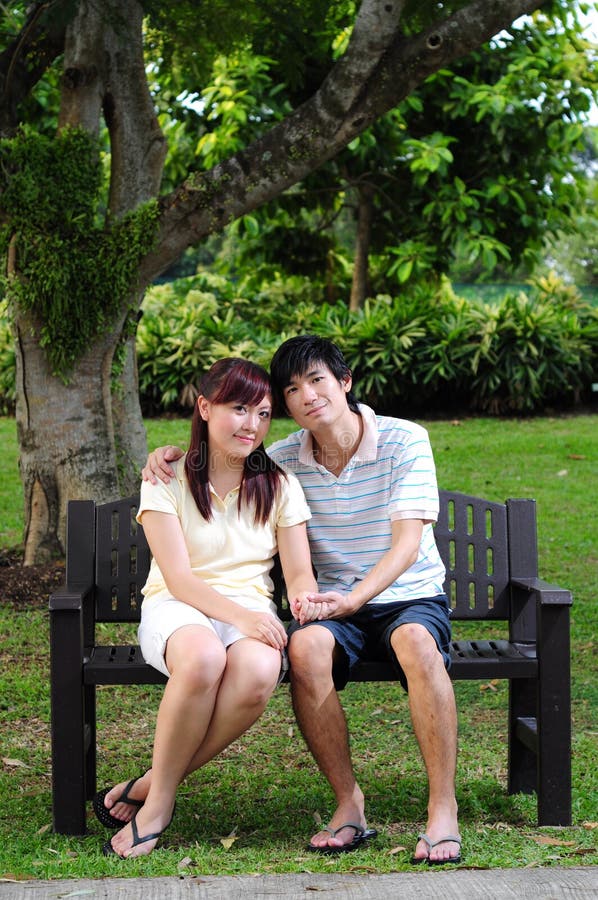 Couple in Love Sitting on Bench with Various Poses Stock Image - Image ...