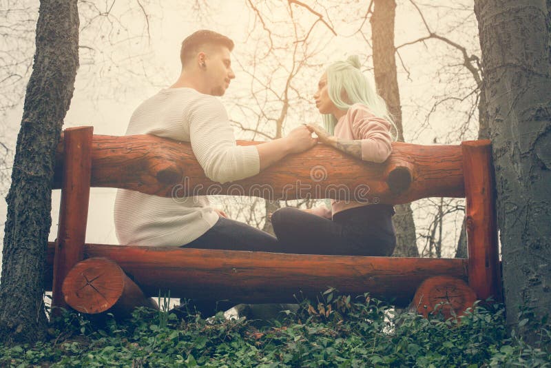 Couple in Love Sitting on Bench. Stock Photo - Image of hipsters, hands ...