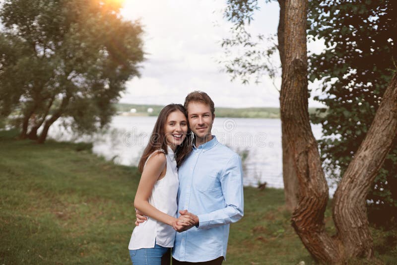 Couple in Love Standing Next To Each Other and Looking at the Ca Stock ...