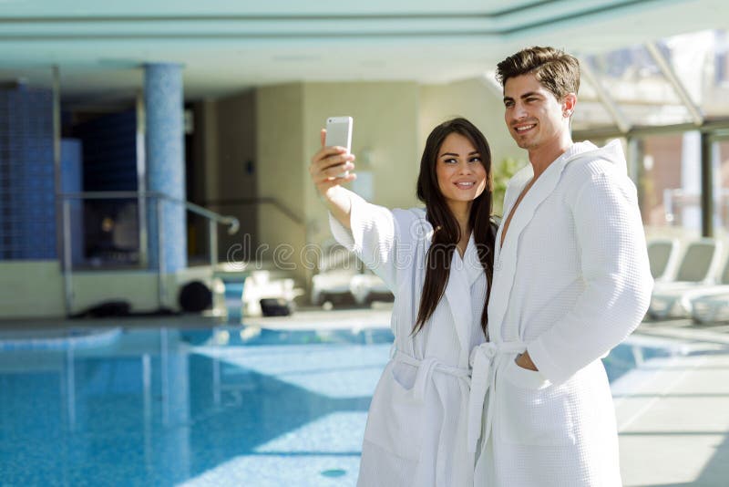 Couple in Love Standing Next To a Pool in a Robe Stock Image - Image of ...