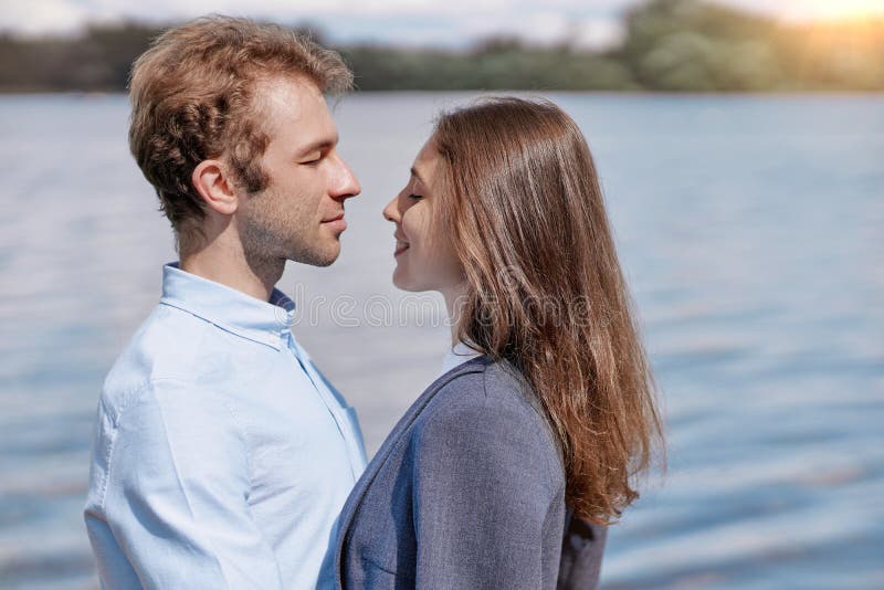 Couple in Love Standing Together on the Shore of the Lake . Stock Image ...