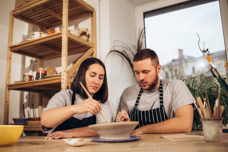 Couple in Love Working Together on Potter Wheel in Craft Studio ...
