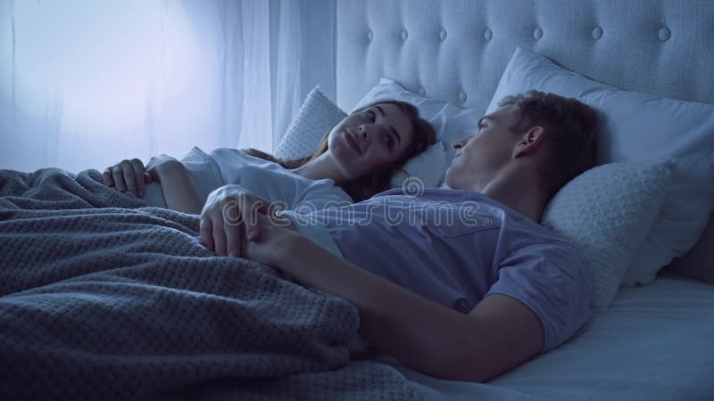 Couple Lying in Bed at Night. Couple Sleeping in Bed. Couple in Bed at ...