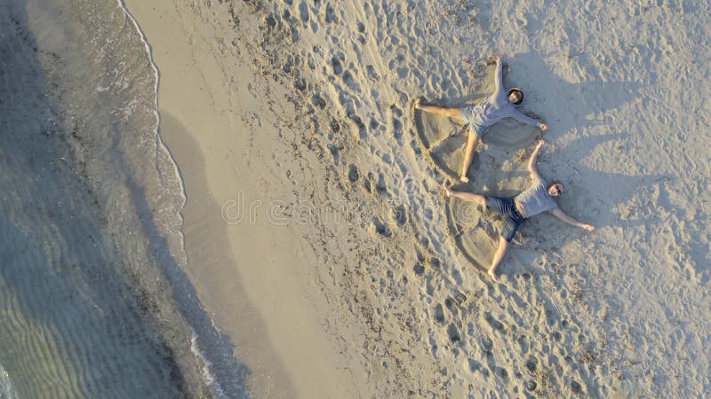Girl Making Sand Angel Stock Photos - Free & Royalty-Free Stock Photos ...