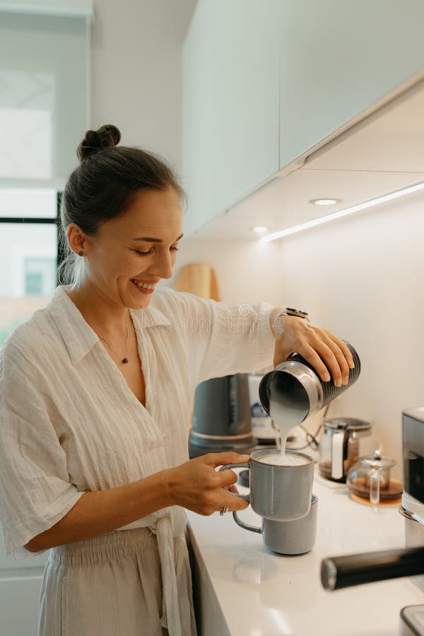 A Couple is Making Coffee in the Kitchen Stock Photo - Image of indoors ...