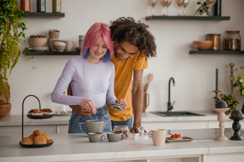 A Couple Making Tea in the Kitchen Stock Photo - Image of togetherness ...
