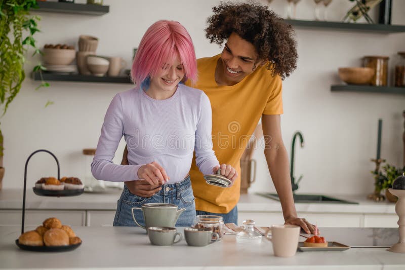 A Couple Making Tea in the Kitchen Stock Image - Image of morning ...
