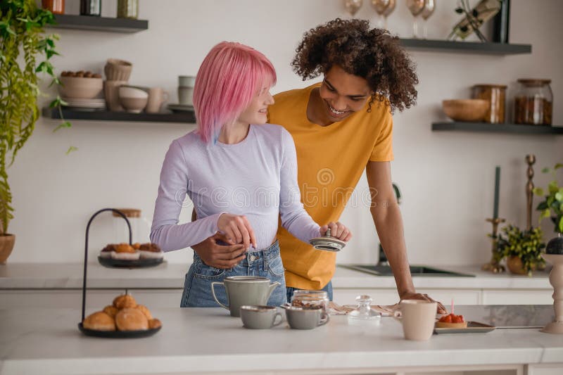 A Couple Making Tea in the Kitchen Stock Photo - Image of domestic ...