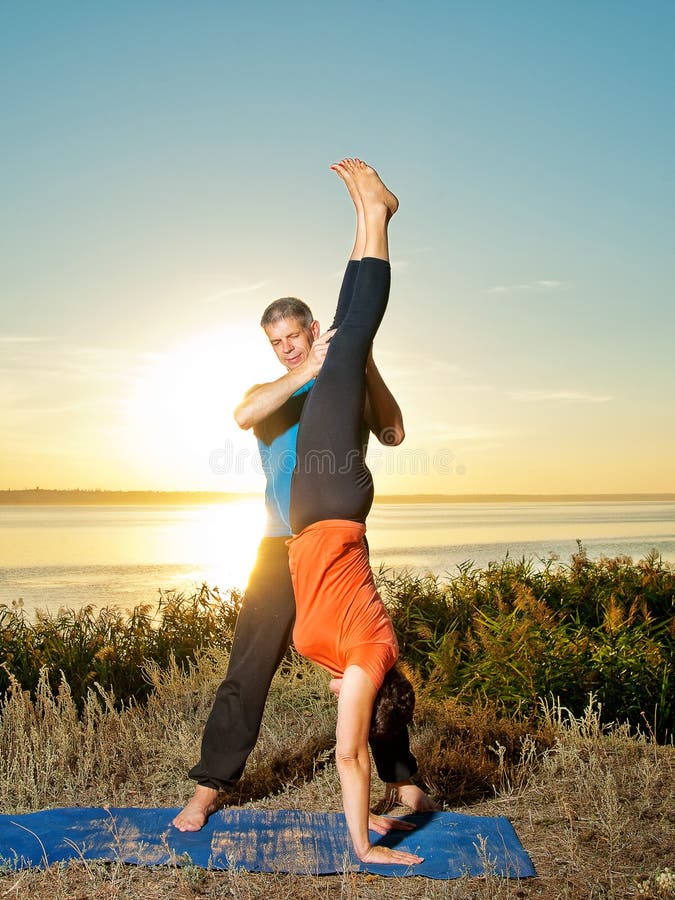 Couple Making Yoga Exercises Outdoors Stock Image - Image of desert ...