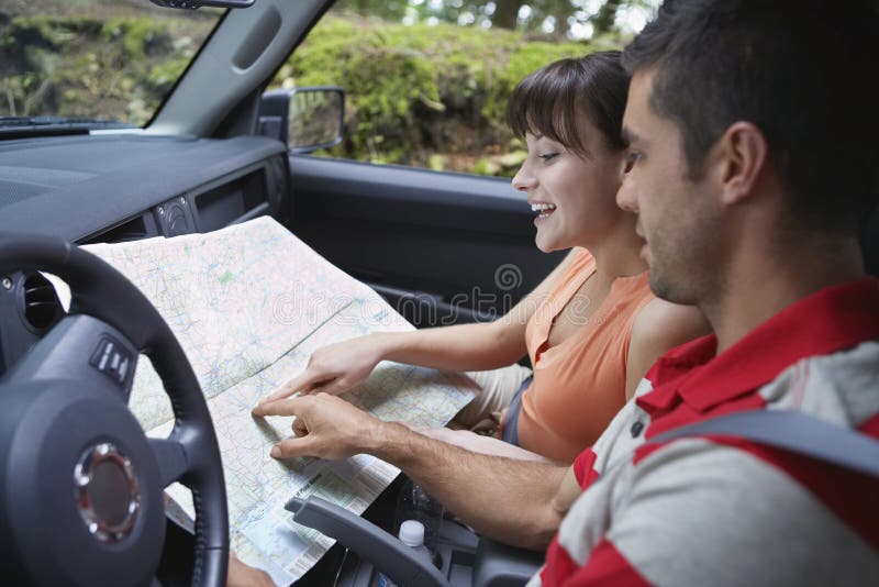 Couple with Map in Car stock image. Image of lost, adventure - 33896425