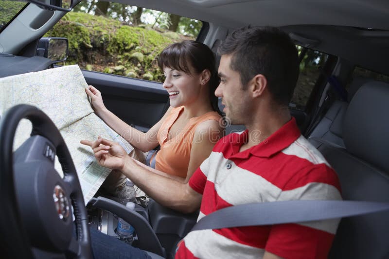 Couple with Map in Car stock photo. Image of relaxation - 33899772