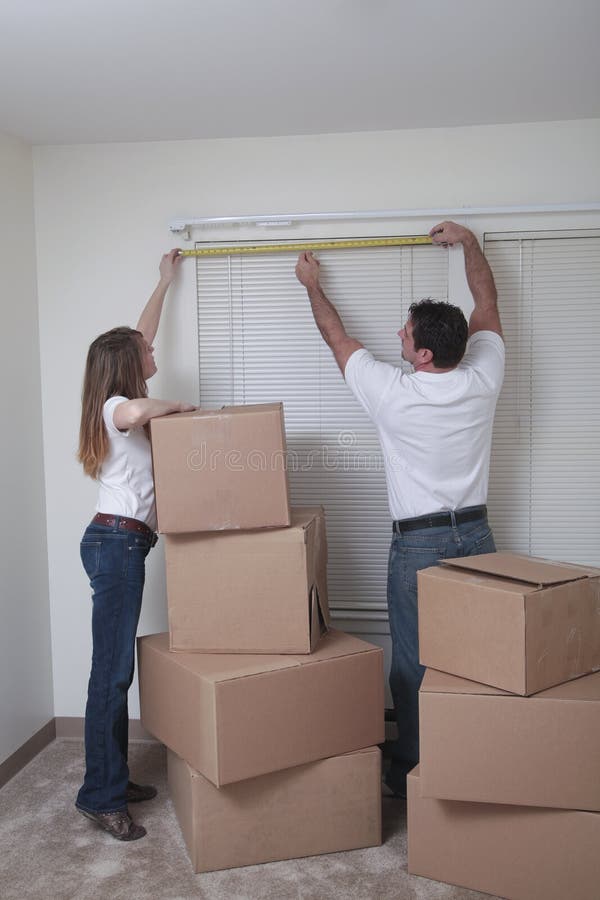Couple measuring stock image. Image of female, boxes - 14634479