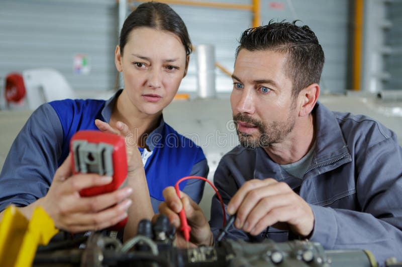 Couple Mechanics Repairing Engine Race Car Stock Image - Image of ...