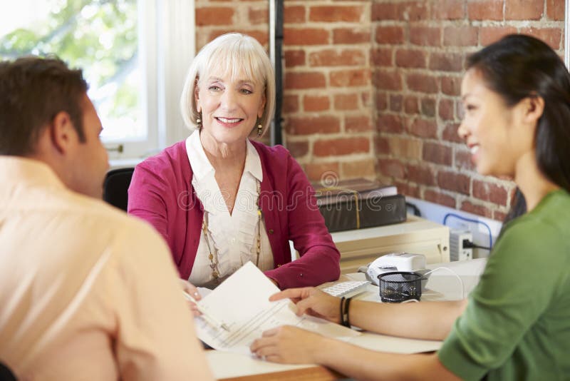 Couple Meeting with Financial Advisor in Office Stock Photo - Image of ...