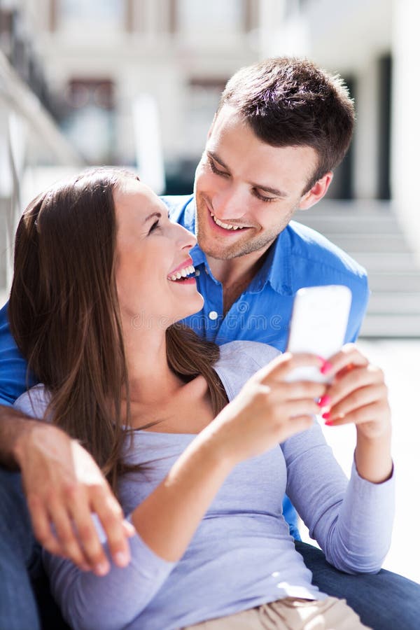 Couple with mobile phone stock image. Image of phone - 32620375