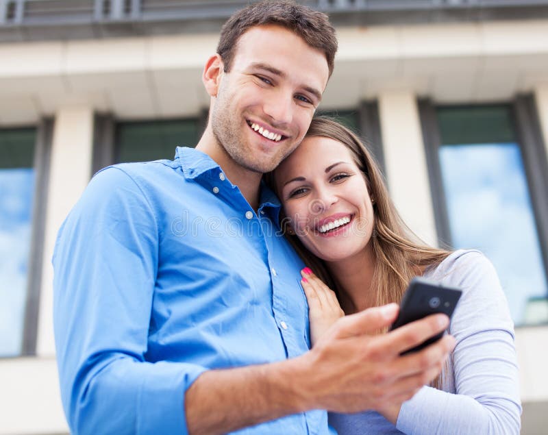 Couple with mobile phone stock photo. Image of text, phone - 32760918