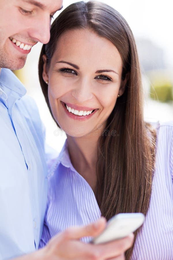 Couple with mobile phone stock image. Image of phone - 32620375