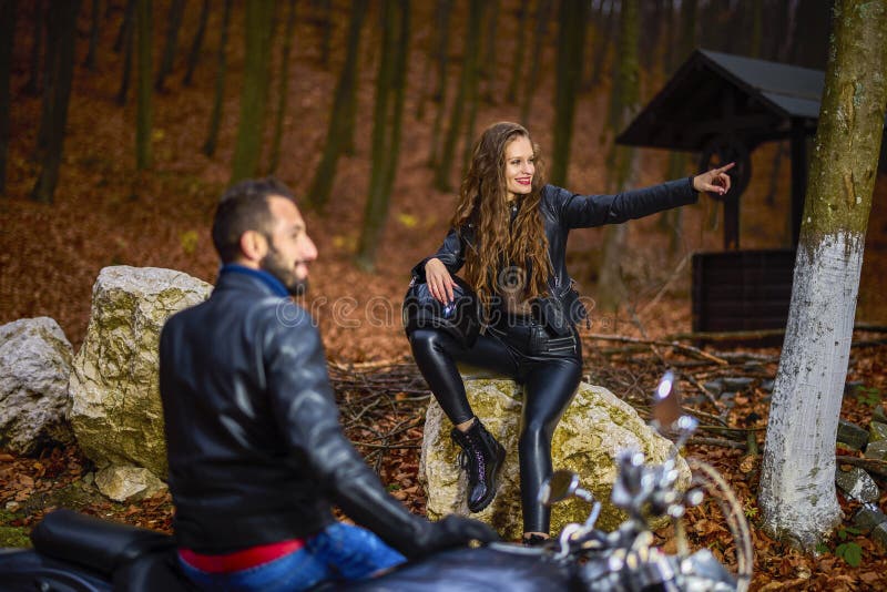 Couple of Motorcyclists with a Chopper. Stock Image - Image of couples ...
