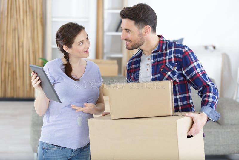 Couple moving in house stock photo. Image of casual - 160603656