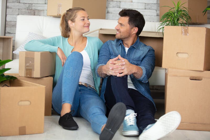 Couple Moving in House Sitting on Floor with Box Stock Image - Image of ...