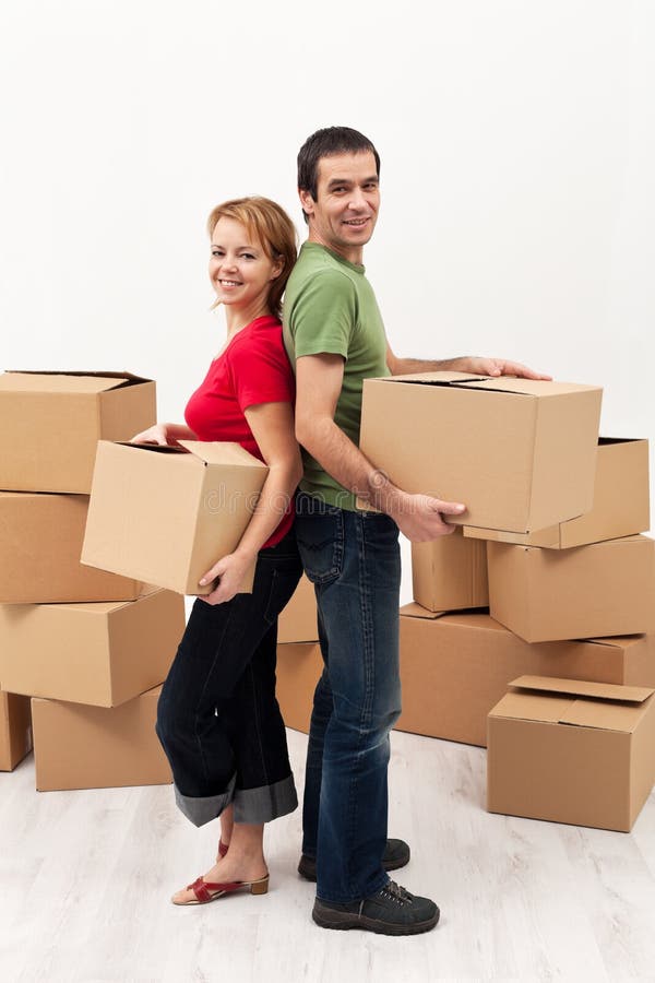 Happy Couple Moving into New Home Stock Photo - Image of race, looking ...