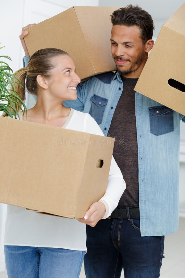 Couple moving in together stock image. Image of support - 196684365
