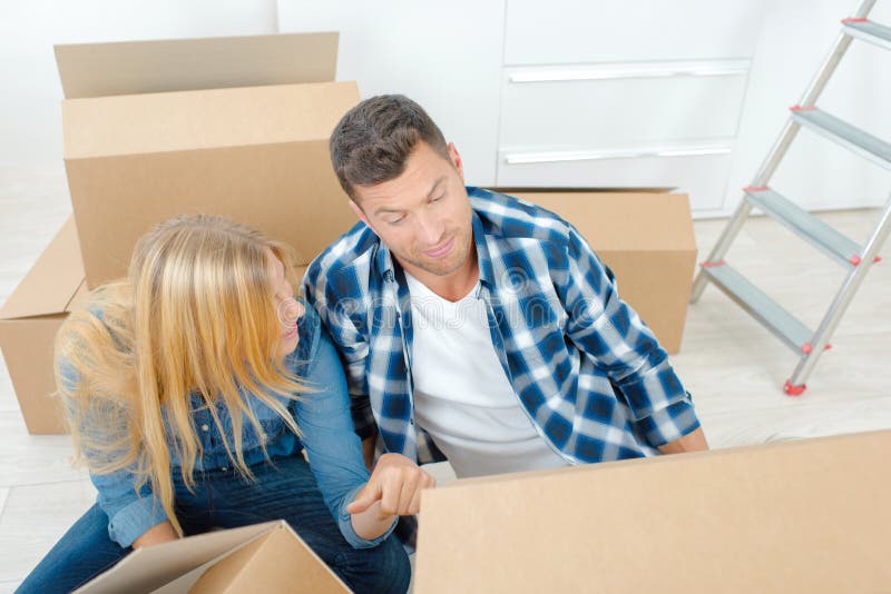 Couple moving in together stock photo. Image of female - 263894216
