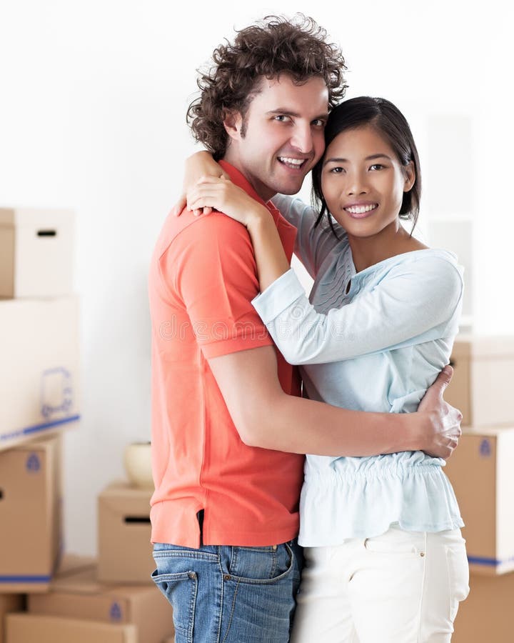 Couple Moving in stock photo. Image of ethnic, casual - 30903680