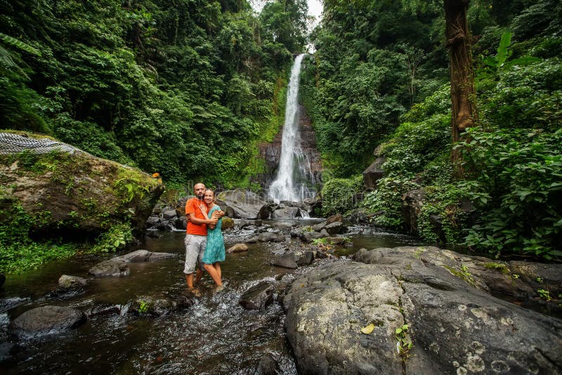 Couple Near Gitgit Waterfall on Bali in Indonesia Stock Photo - Image ...
