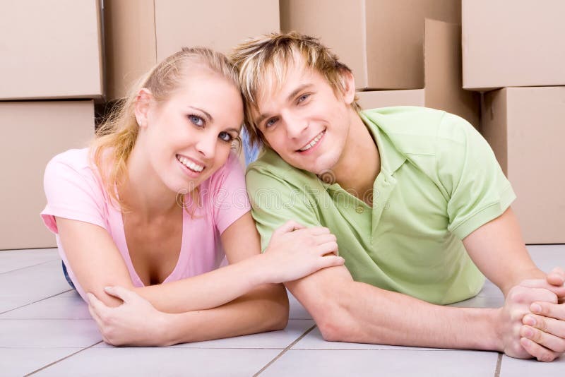 Happy Couple Moving To New Home Smiling Stock Image - Image of embrace ...