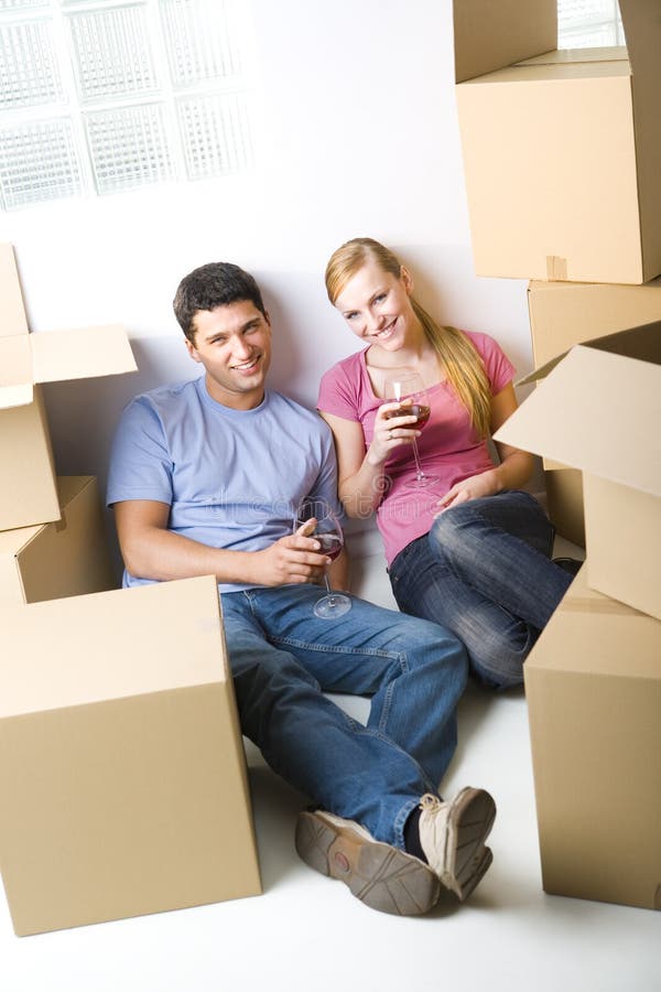 Happy Couple Moving To New Home Smiling Stock Image - Image of embrace ...