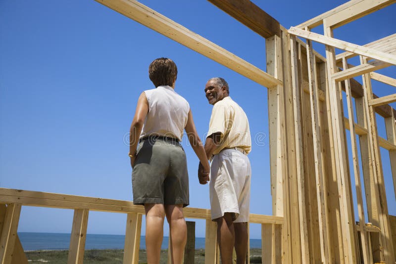 Couple Building Home stock photo. Image of framed, blueprints - 12666316