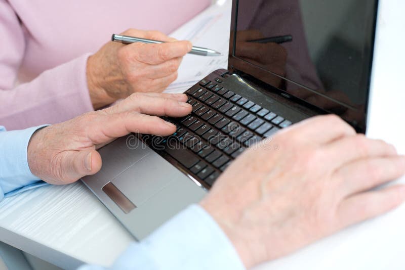 Couple old hands typing stock photo. Image of information - 99539716