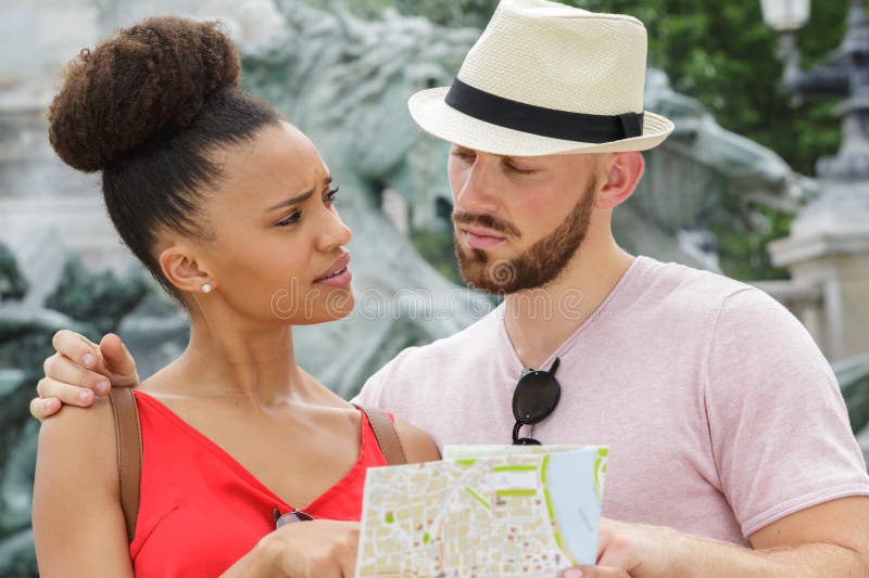 Couple Opposing Each Other on Map Decision Stock Photo - Image of ...