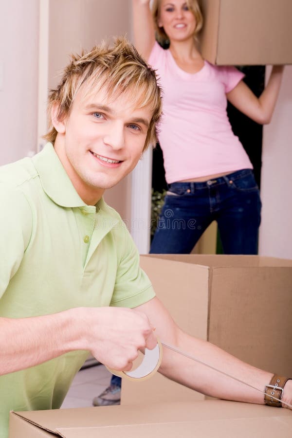 Couple Packing Boxes To Move Stock Photo - Image of couple, apartment ...