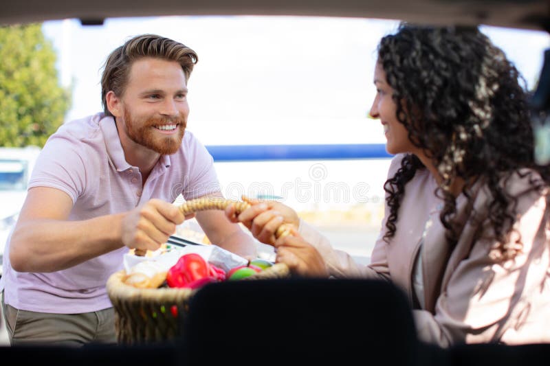 Couple Packing Groceries in Trunk Car Stock Photo - Image of girl ...